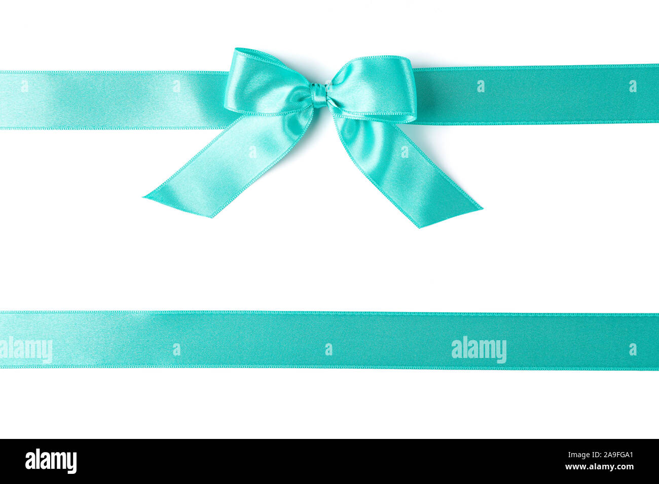Turquoise ribbons with bow isolated on white background. Gift concept ...