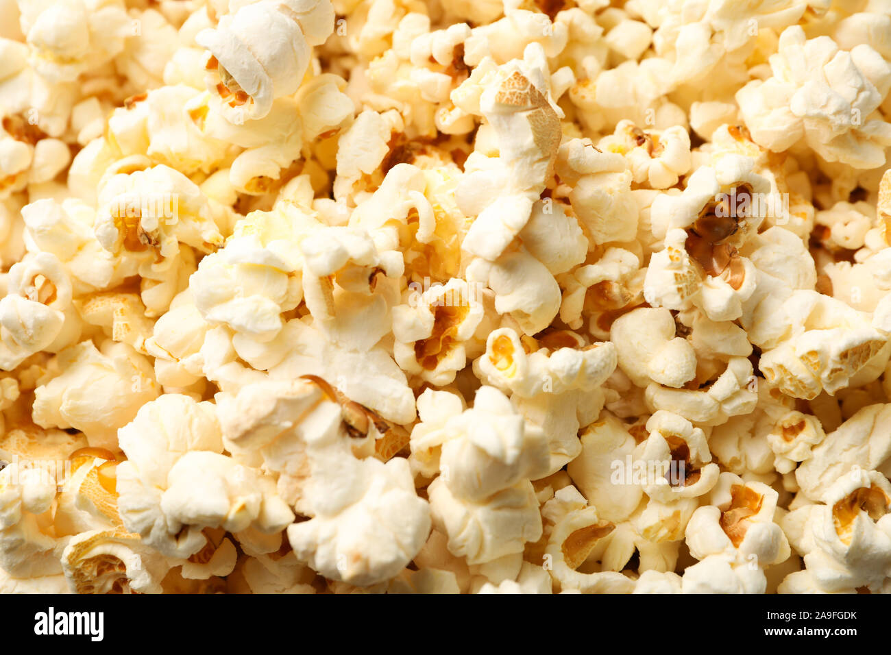 Delicious popcorn on whole background, close up Stock Photo - Alamy
