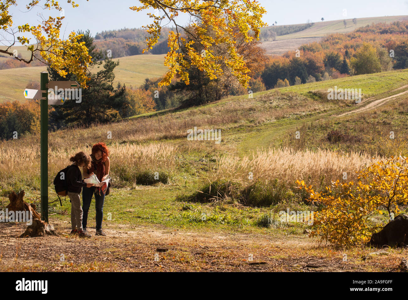 adventure travelers with holding a map to find directions and walking ...