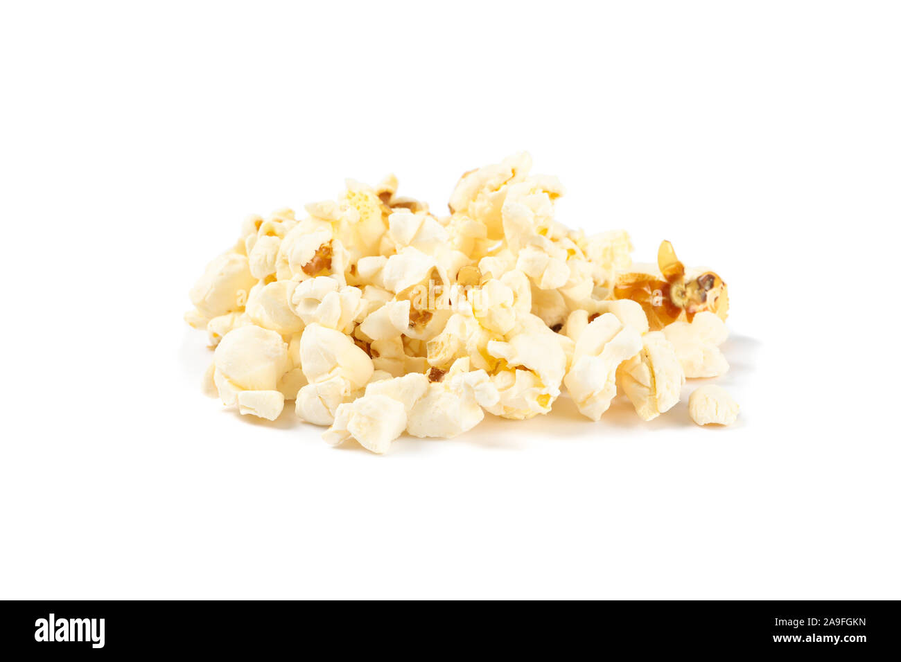 Popcorn pile isolated on white background, close up Stock Photo - Alamy