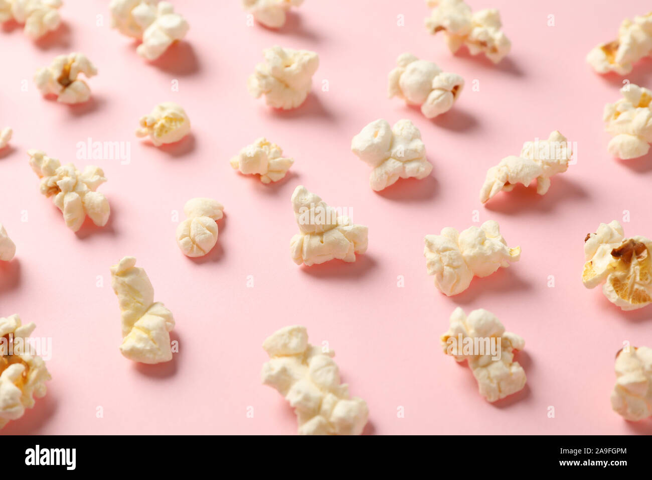 Flat lay composition with popcorn on pink background, closeup Stock ...