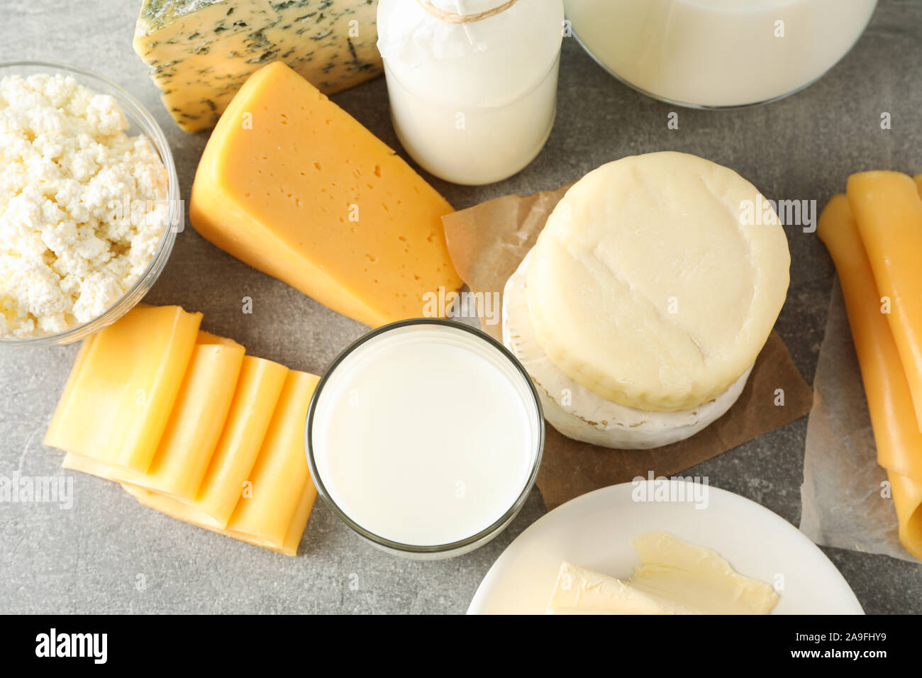 Different dairy products on grey background, top view Stock Photo - Alamy