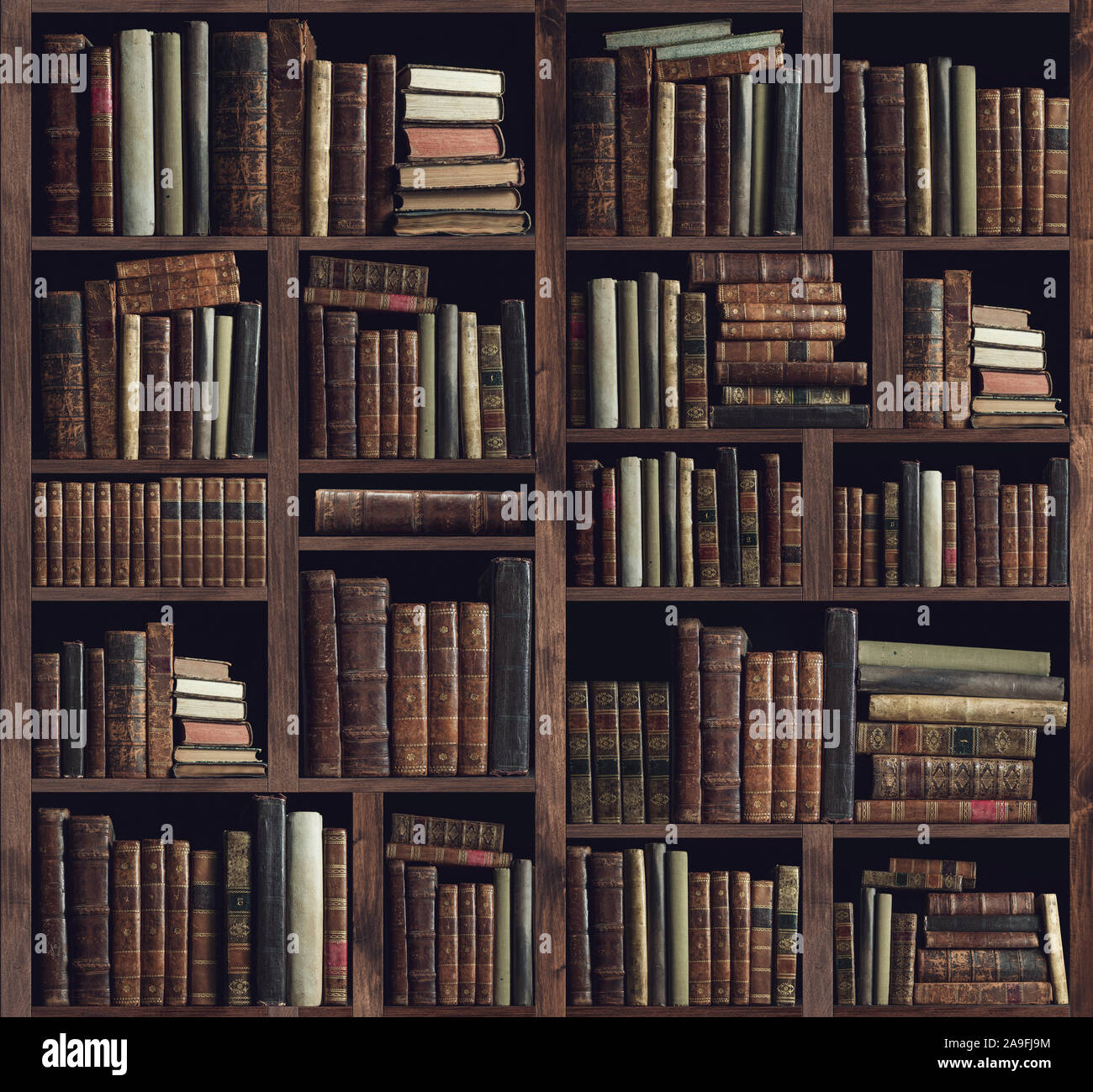 Collection of valuable ancient books on a wooden bookcase: knowledge ...