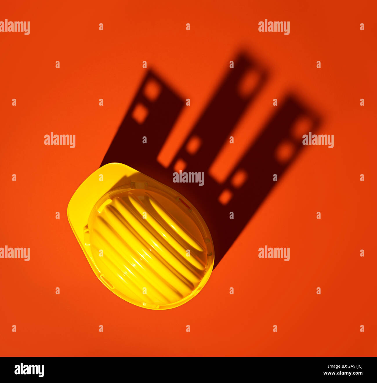 Work safety helmet casting a shadow of buildings: architecture ...