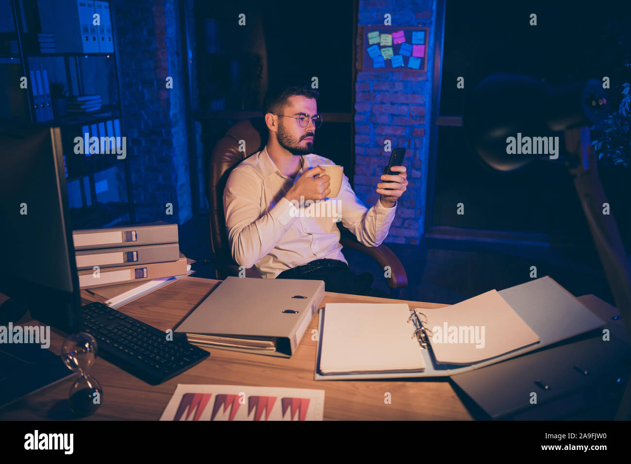 Photo of thoughtful interested man informing his colleagues about his ...
