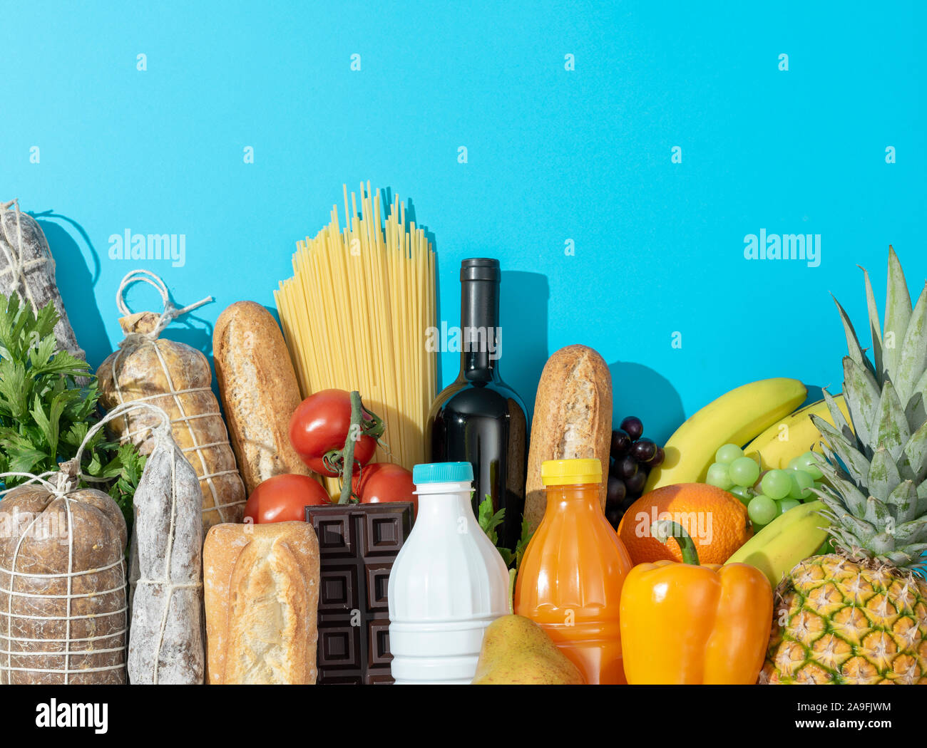 Fresh assorted grocery shopping items: vegetables, fruit, drinks, dairy ...