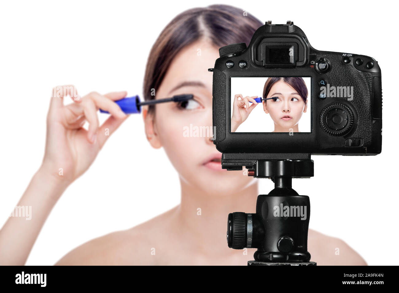Asian Beauty Blogger Showing How To Apply Mascara Make Up For Her Vlog