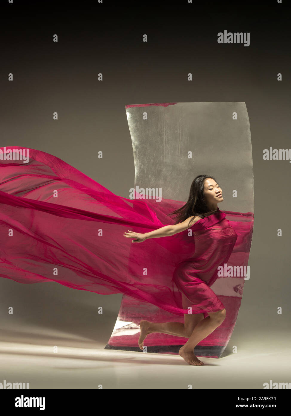 On my way to ideal. Modern ballet dancer on brown background with ...