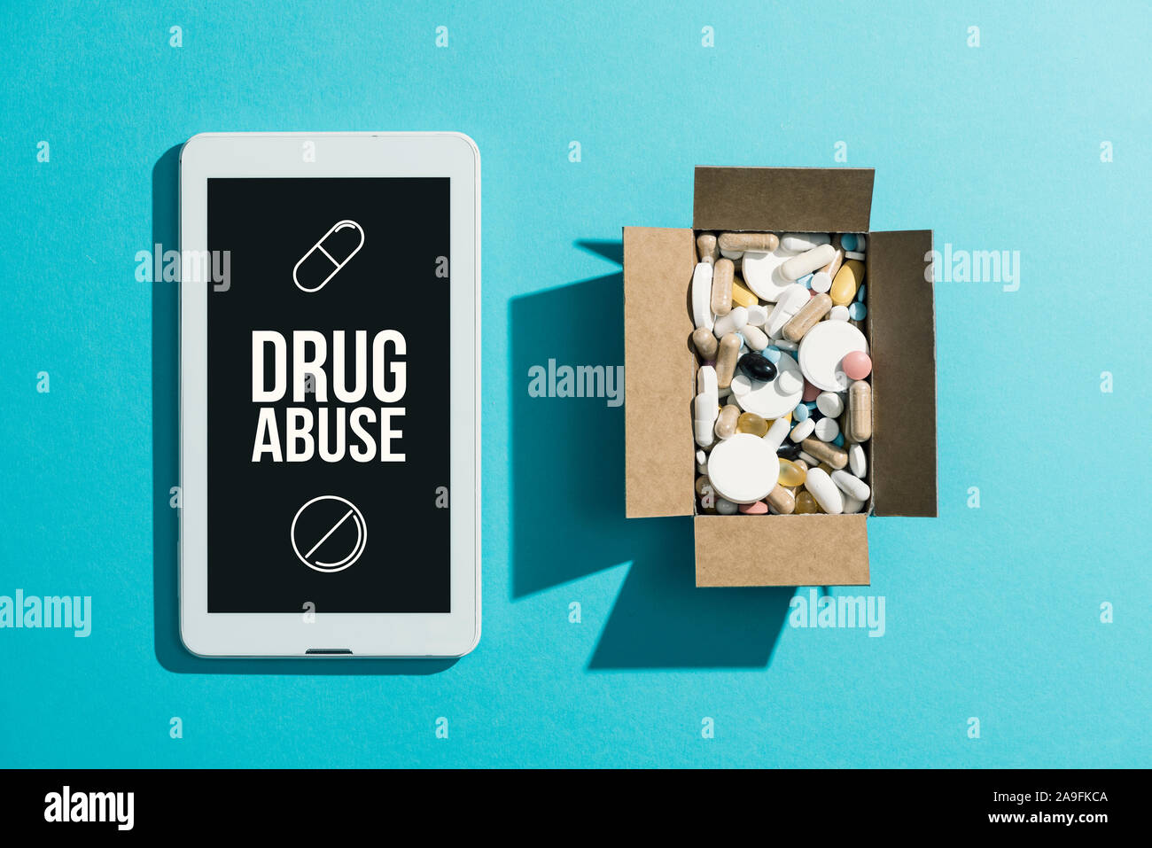 Smartphone and box filled with prescription medicine: drugs abuse and ...