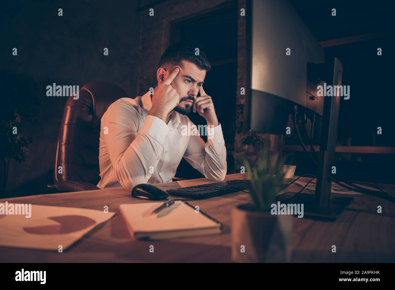 Profile side photo of concentrated marketer man stay evening sit table ...