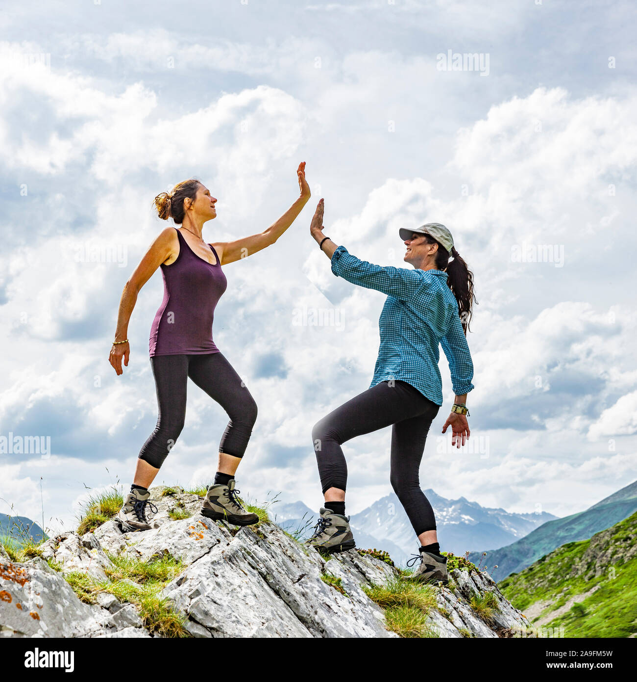 Women climbing mountain hi-res stock photography and images - Alamy
