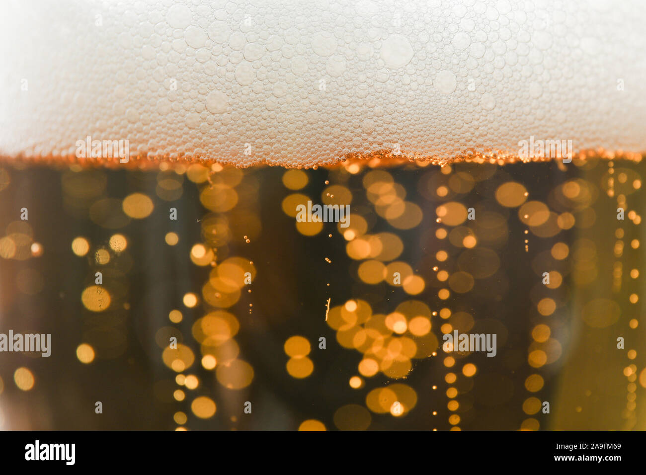 Beer and foam texture on whole background, close up Stock Photo - Alamy