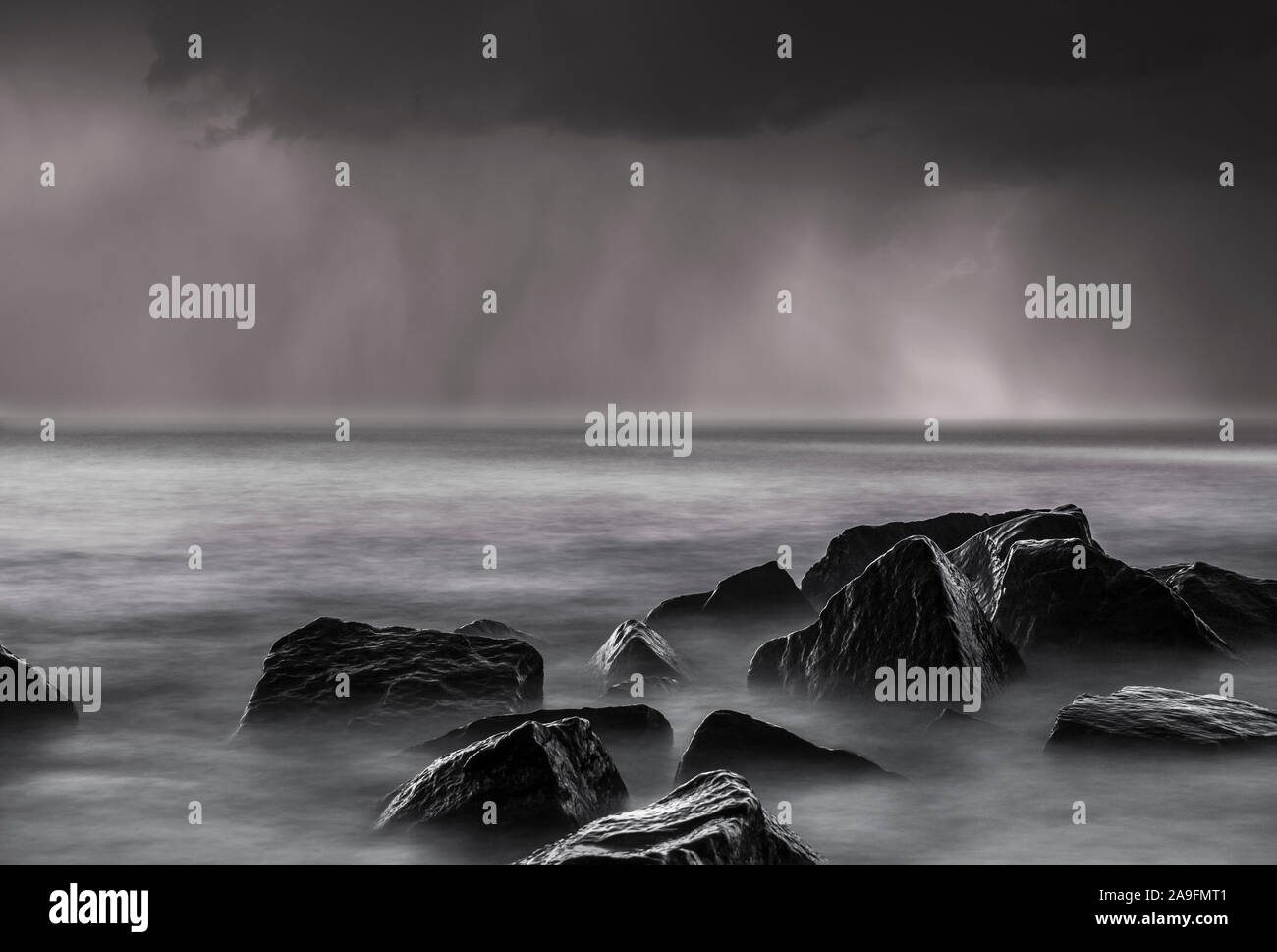 Rainfall over ocean hi-res stock photography and images - Alamy
