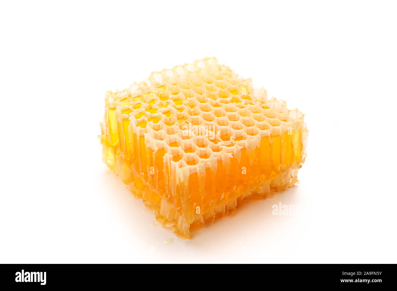 Piece of honeycomb isolated on white background, close up Stock Photo ...