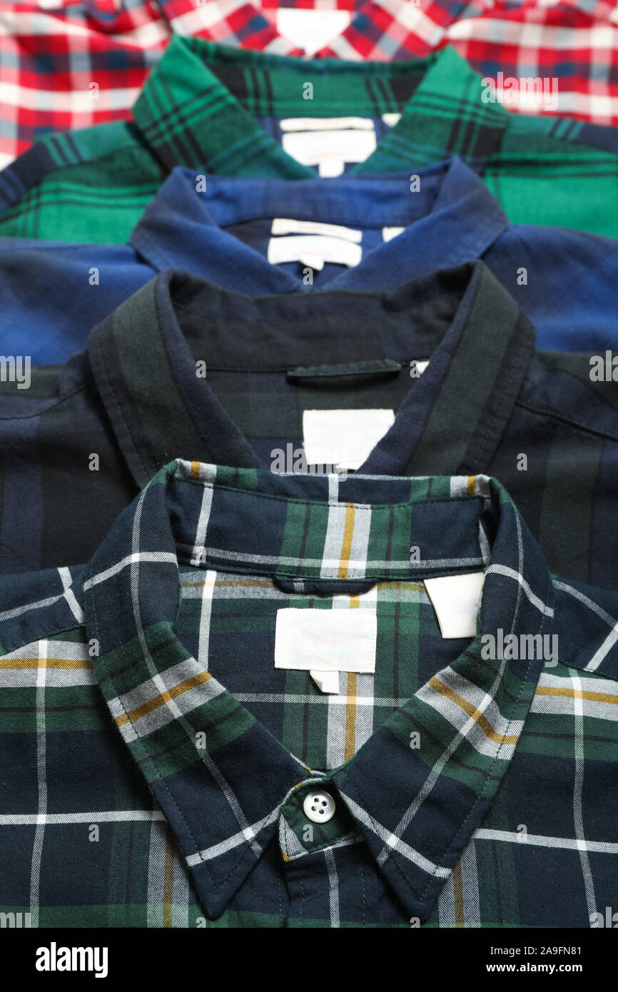 Different color beautiful shirts on whole background Stock Photo - Alamy