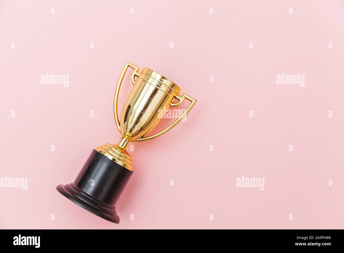 Simply flat lay design winner or champion gold trophy cup isolated on ...