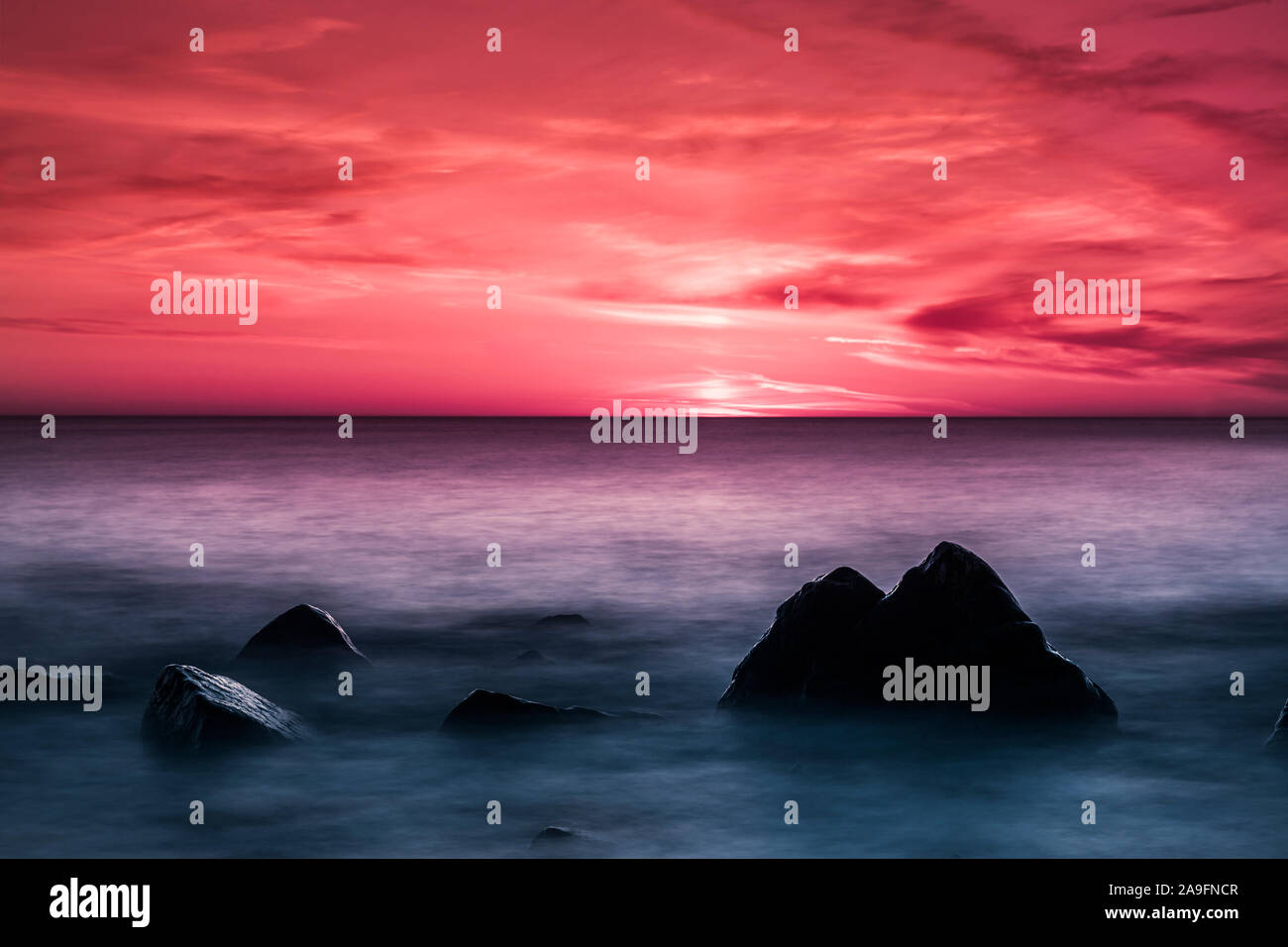 Colorful sunset at the sea with horizon over the water Stock Photo - Alamy