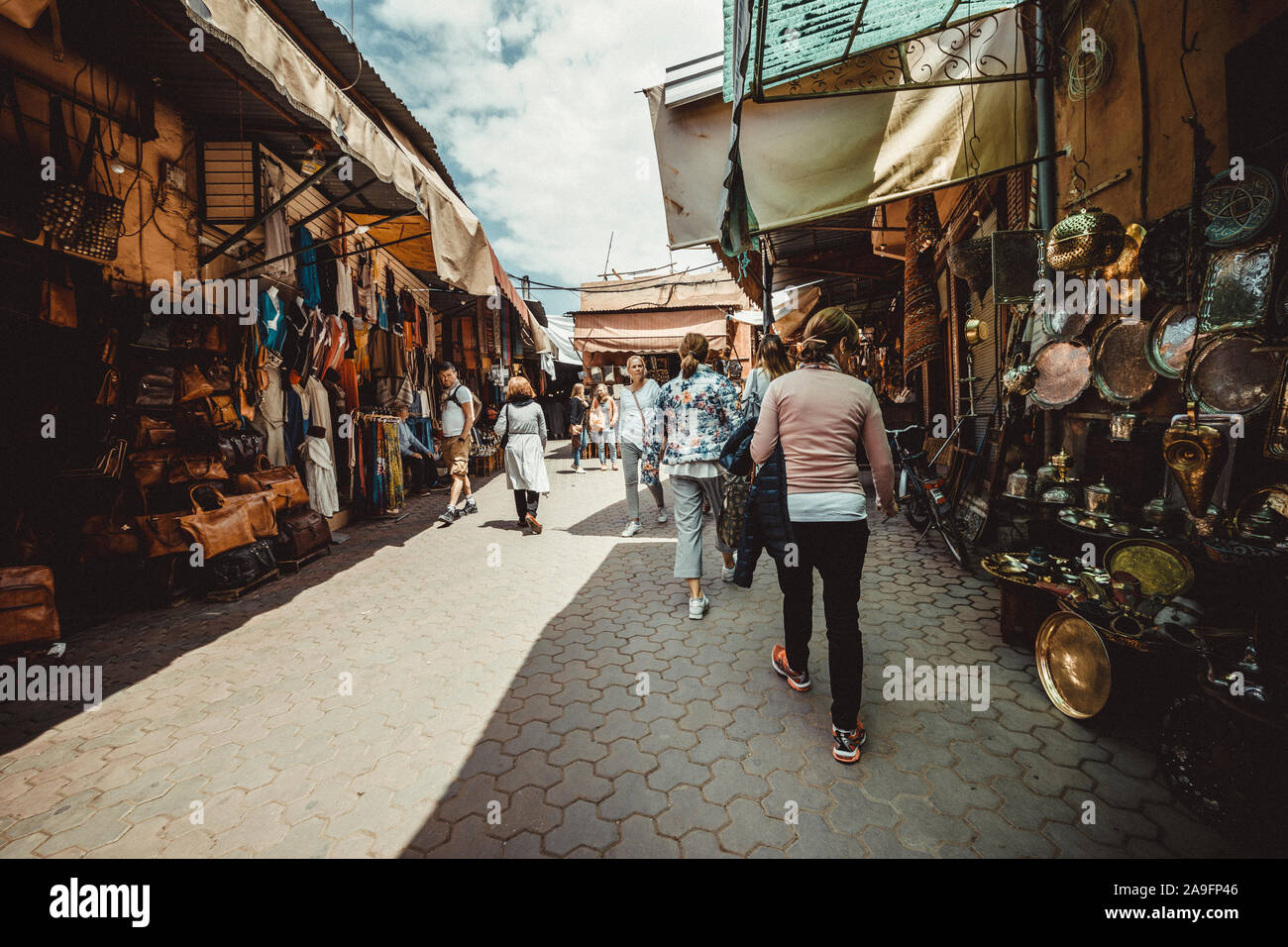 Women walking over traditional streets Stock Photo - Alamy