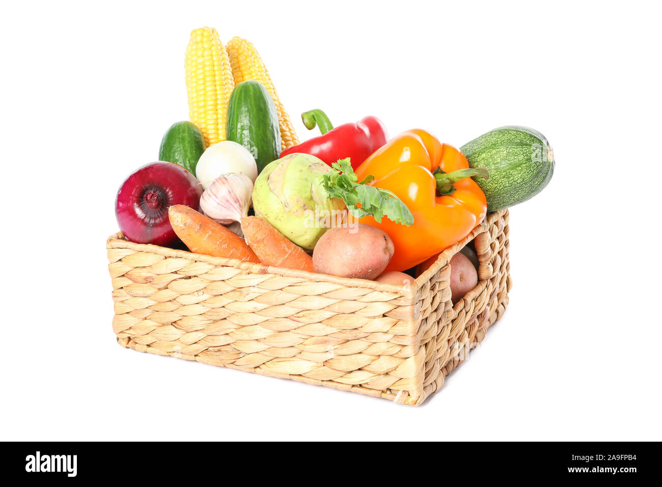 Wicker basket with vegetables isolated on white background Stock Photo ...