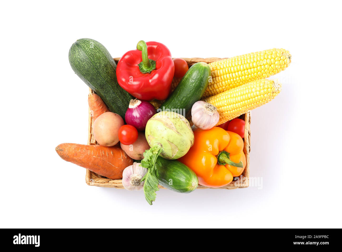 Wicker basket with vegetables isolated on white background Stock Photo ...