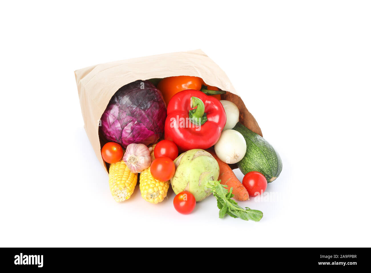 Paper bag with different vegetables isolated on white background Stock ...