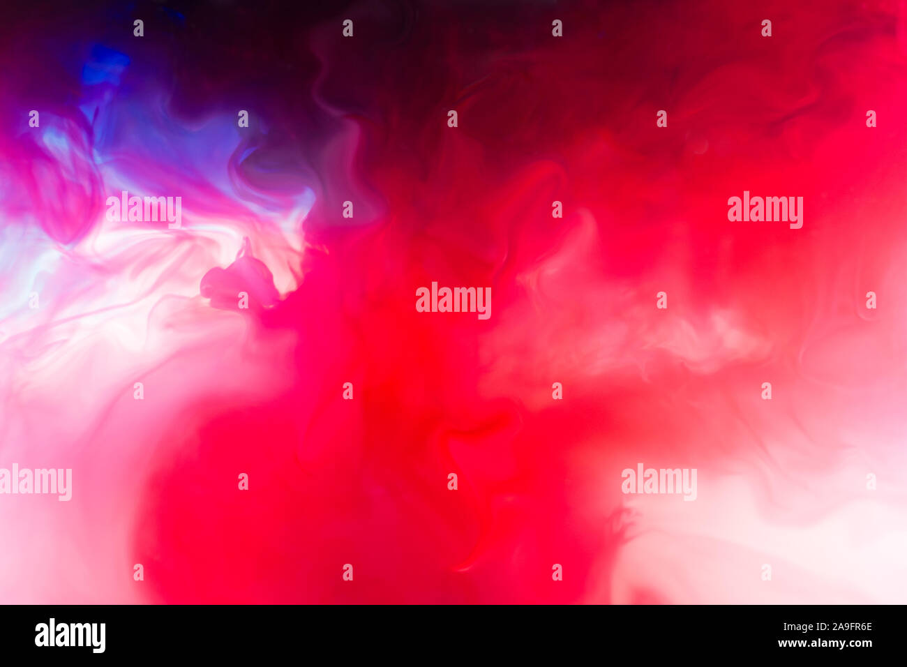 Background with red and blue fluid that mixes in the liquid Stock Photo ...