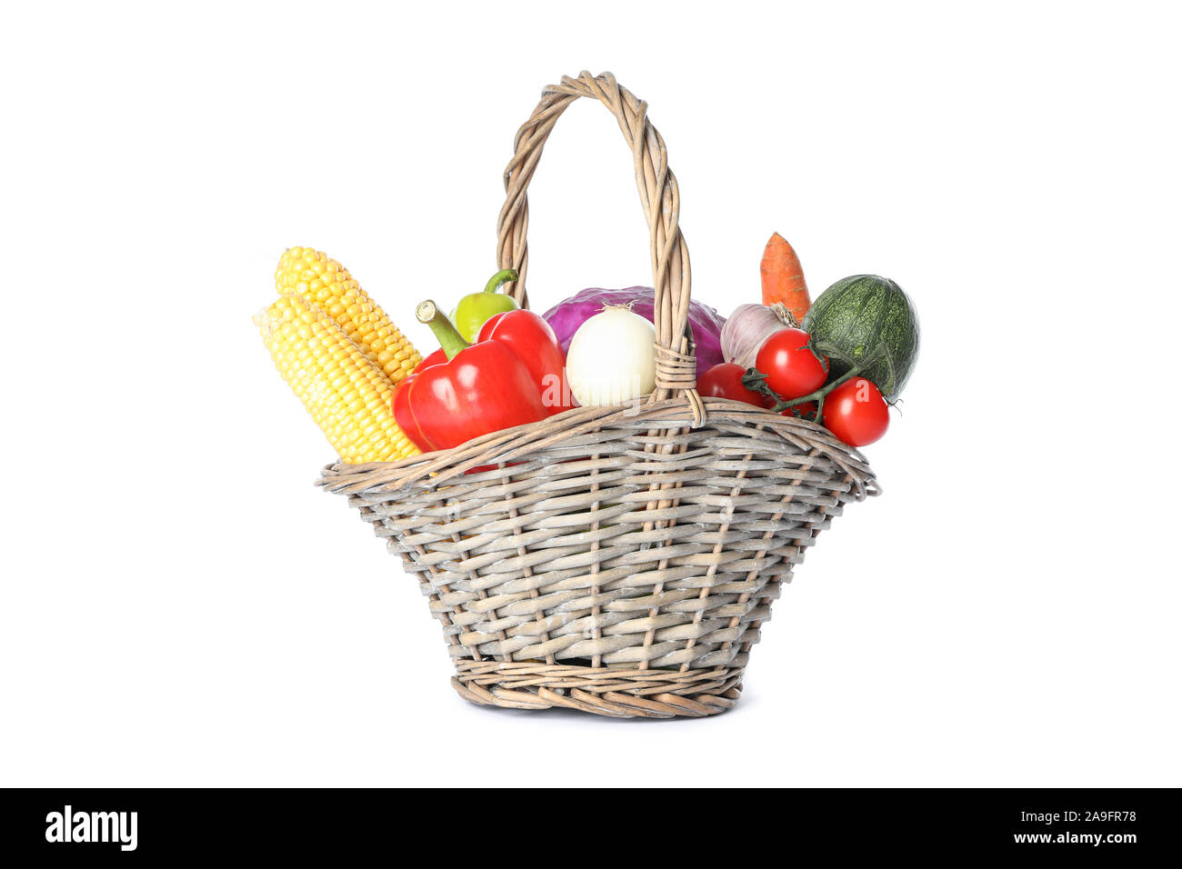 Wicker basket with vegetables isolated on white background Stock Photo ...