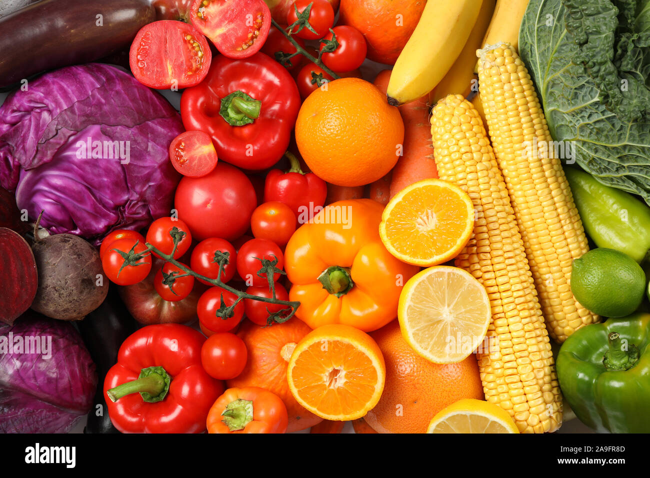 Ripe vegetables and fruits on whole background, close up Stock Photo ...