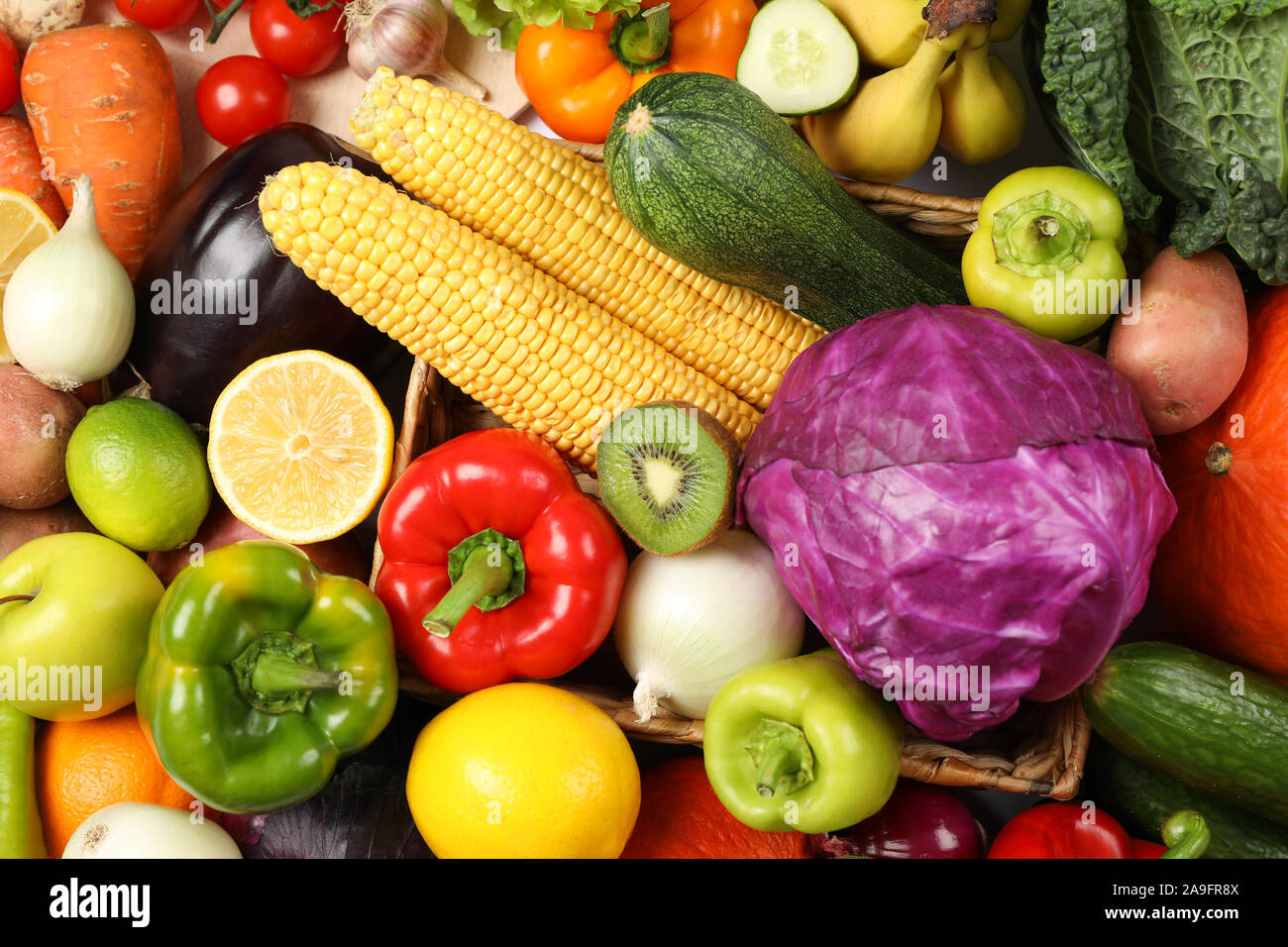 Vegetables and fruits texture on whole background, close up Stock Photo ...