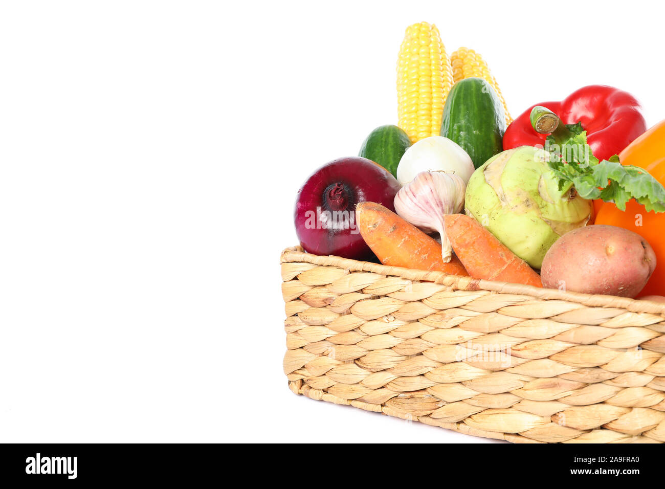 Wicker basket with vegetables isolated on white background Stock Photo ...