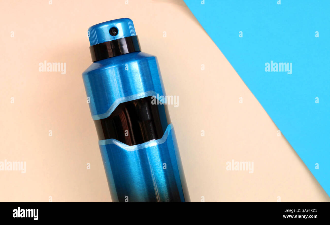 Blue deodorant for men on a white and blue background. Concept of good ...