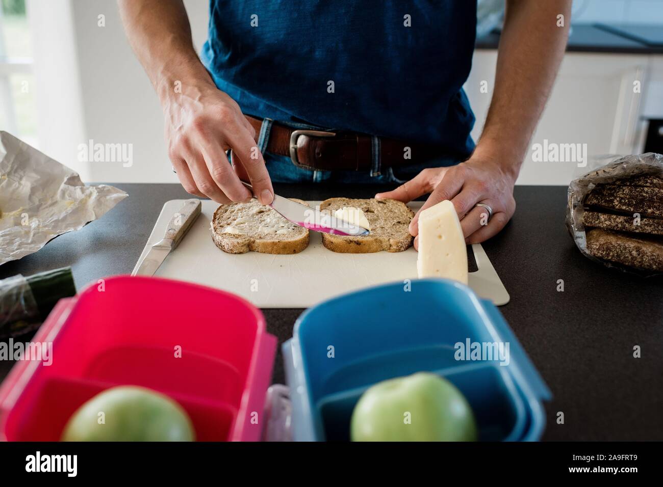 father making a packed lunch for his kids before school Stock Photo - Alamy