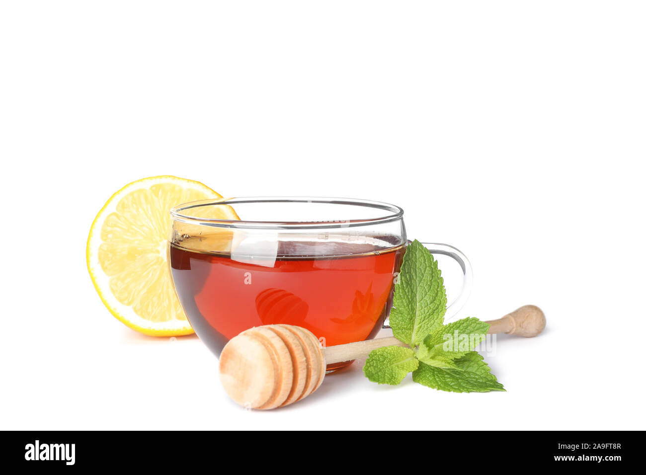 Cup of tea, lemon, mint and dipper isolated on white background Stock ...