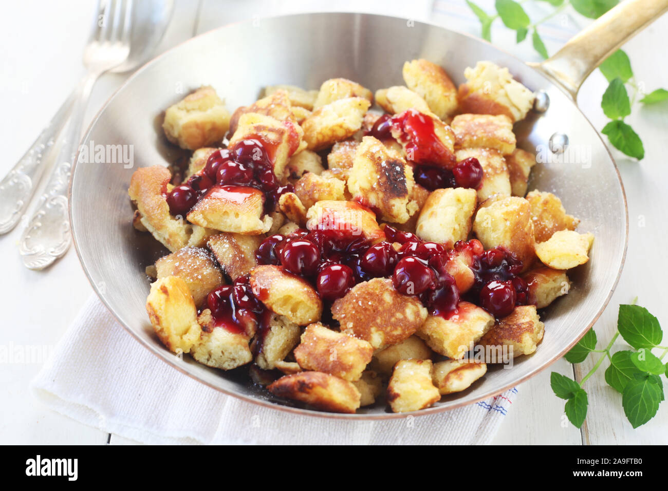 Traditional Austrian Kaiserschmarrn Dessert In A Copper Pan Stock Photo ...