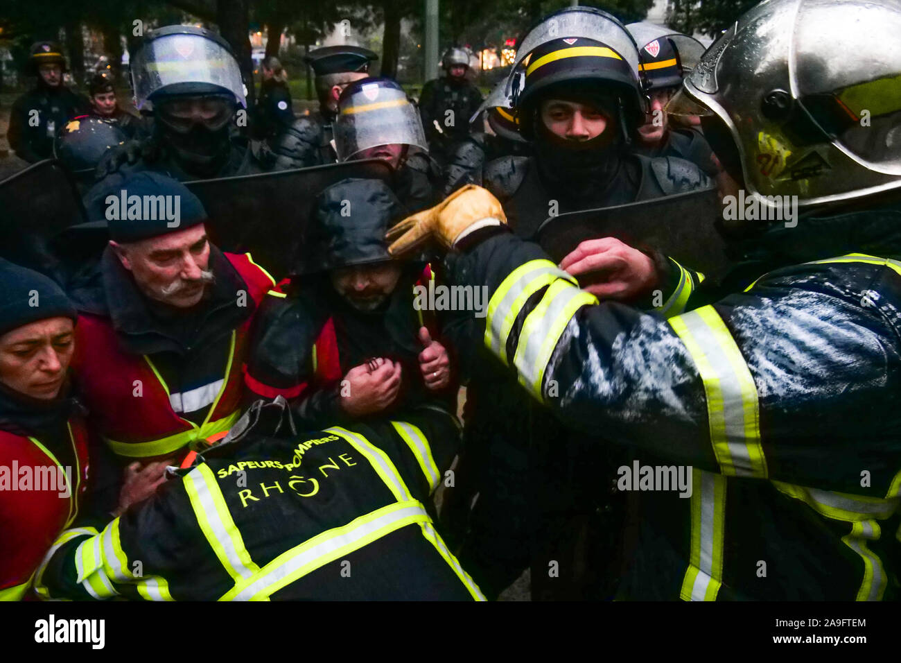 Face to face between striking fire fighters and riot police officers ...