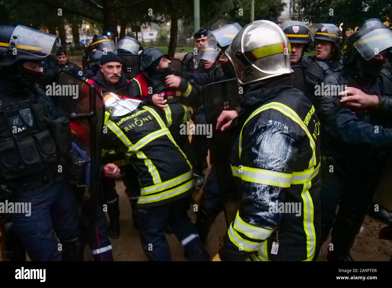 Face to face between striking fire fighters and riot police officers ...