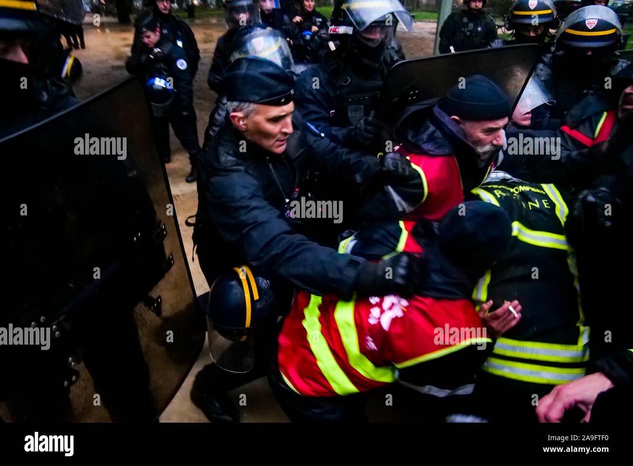 Face to face between striking fire fighters and riot police officers ...