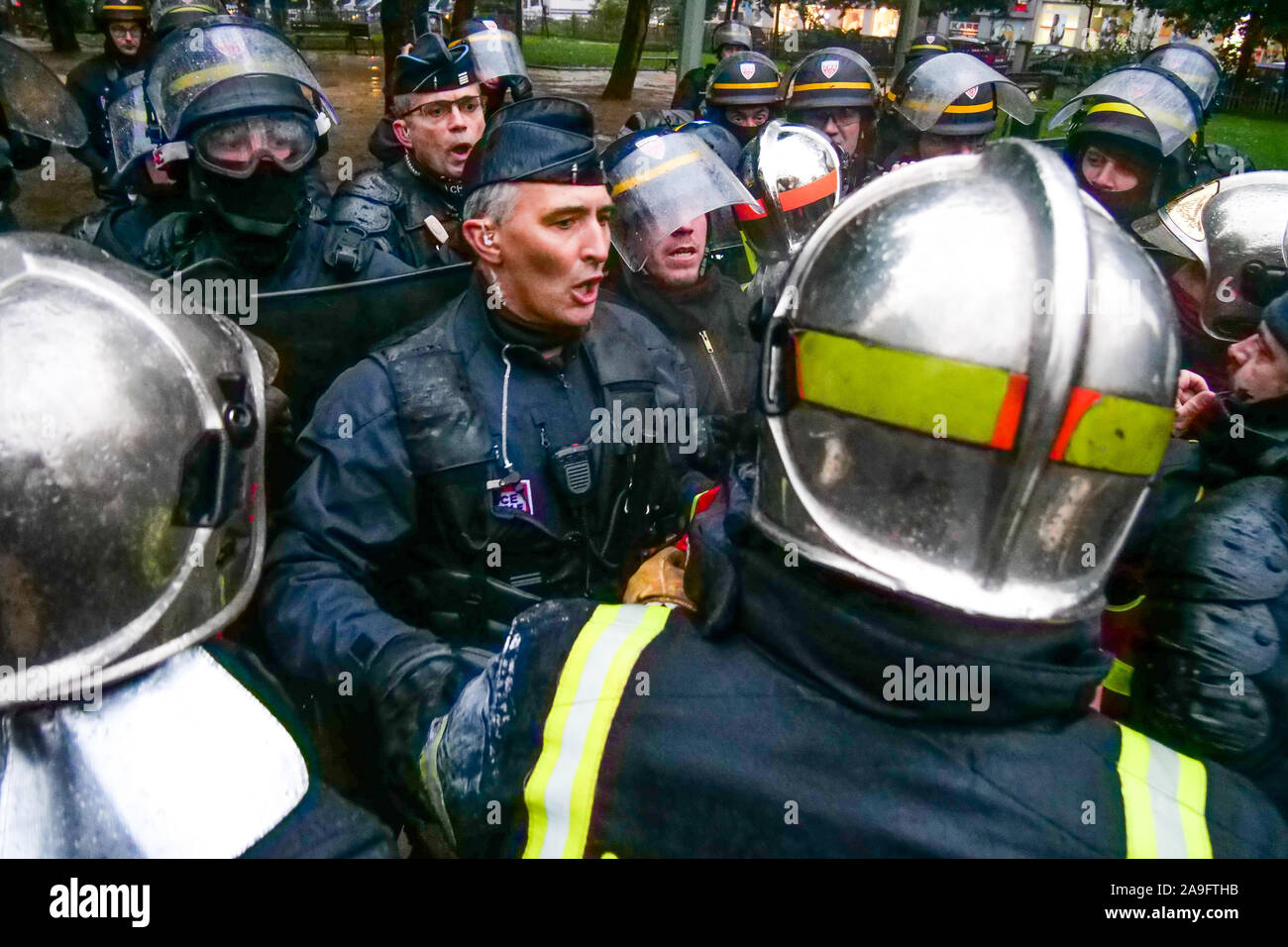Face to face between striking fire fighters and riot police officers ...