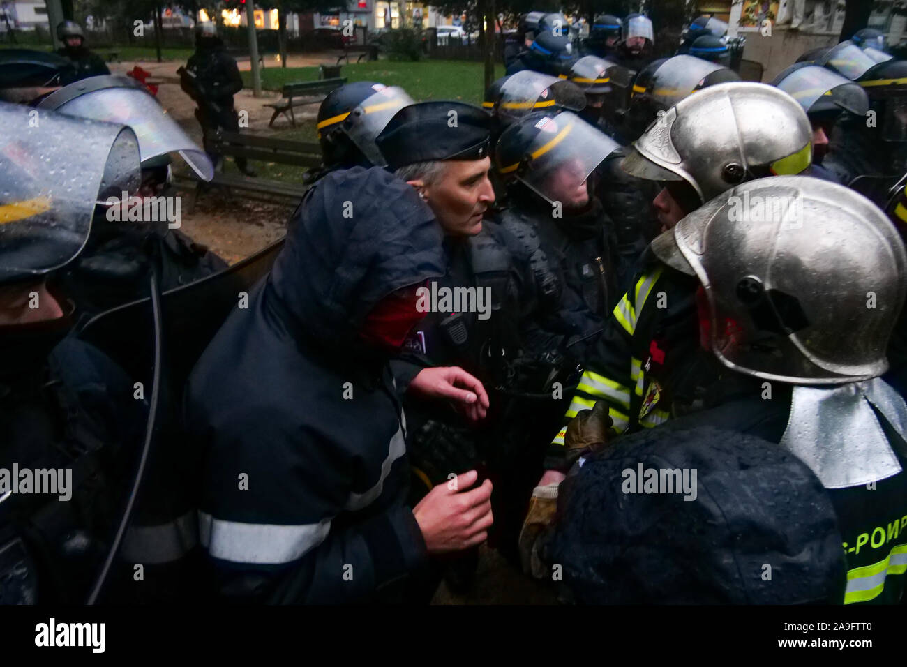 Face to face between striking fire fighters and riot police officers ...