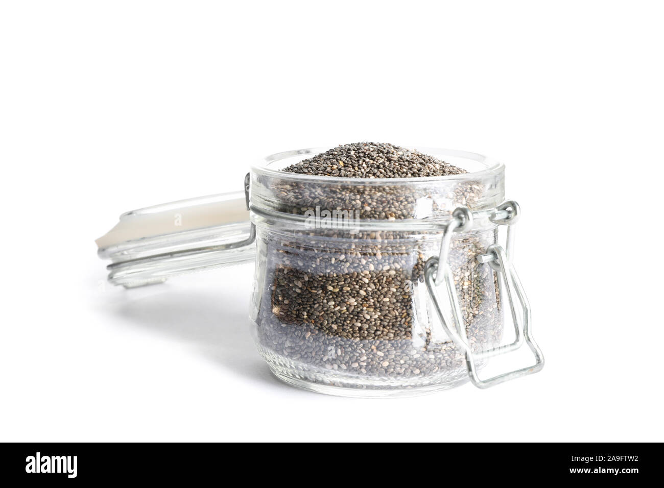 Chia seeds in glass jar isolated on white background Stock Photo - Alamy