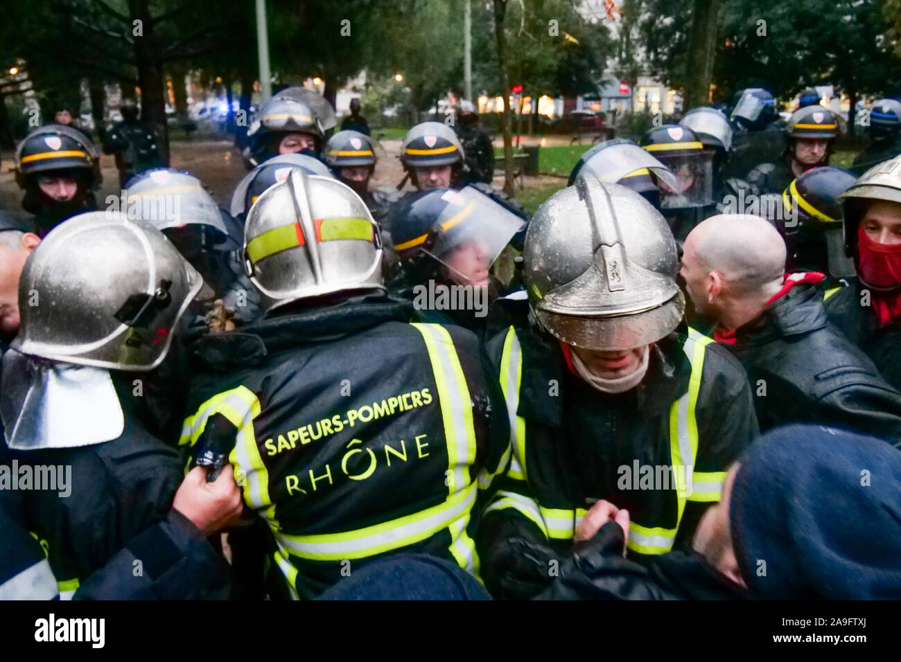 Face to face between striking fire fighters and riot police officers ...
