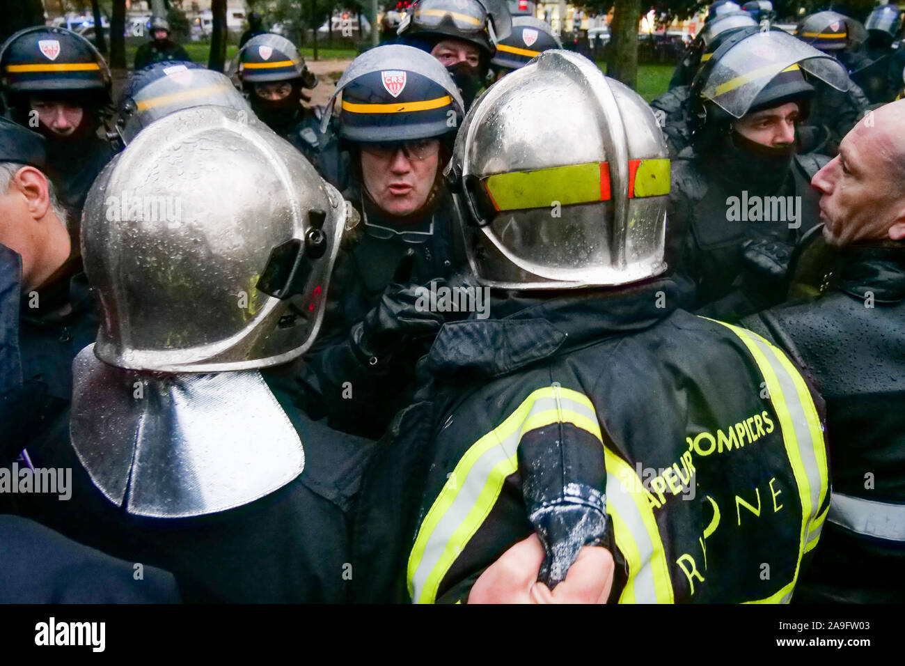 Face to face between striking fire fighters and riot police officers ...
