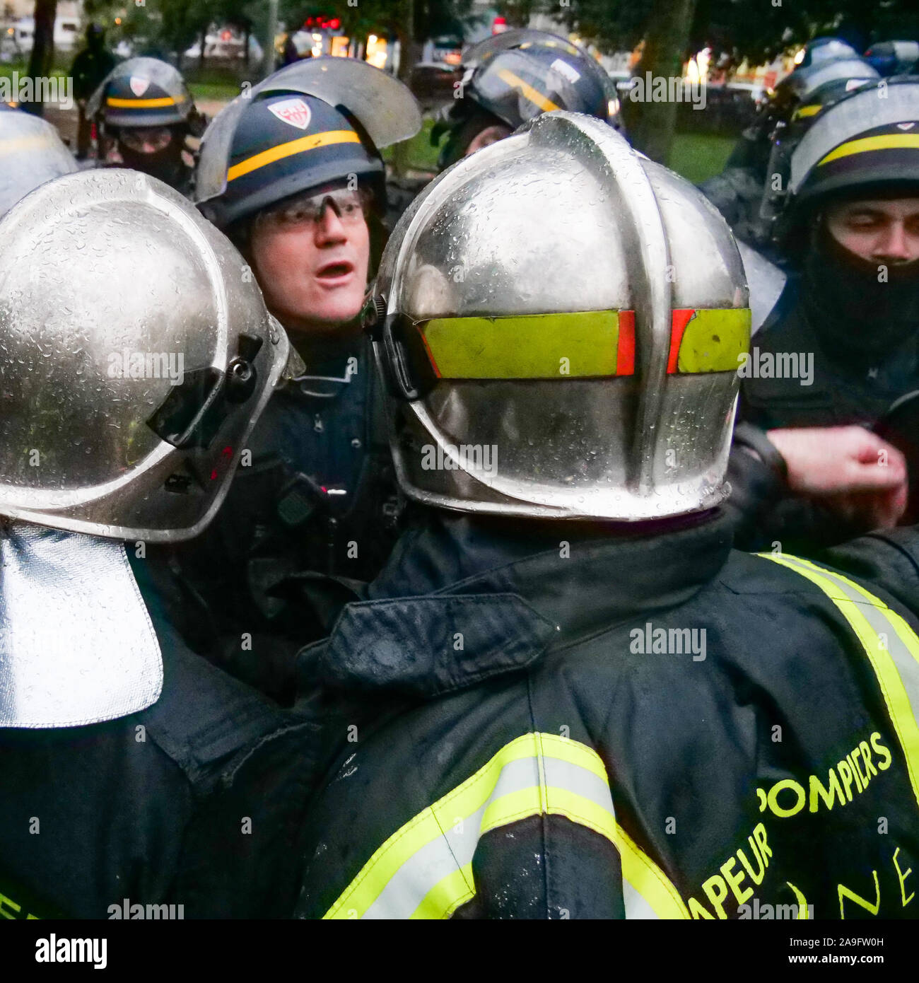 Face to face between striking fire fighters and riot police officers ...