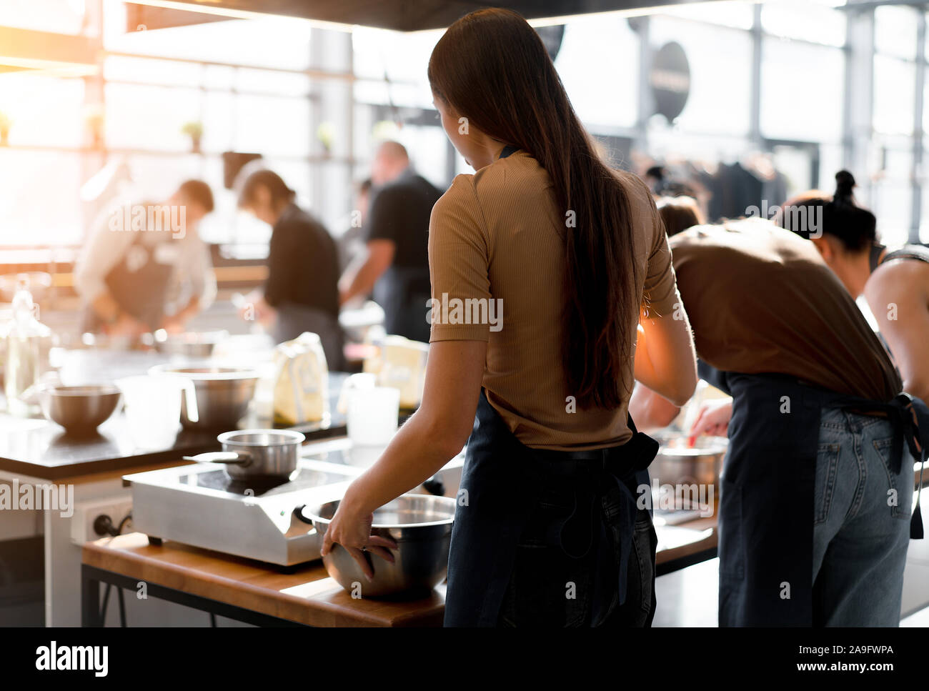 Culinary class. Back view of the process of cooking. Different ...