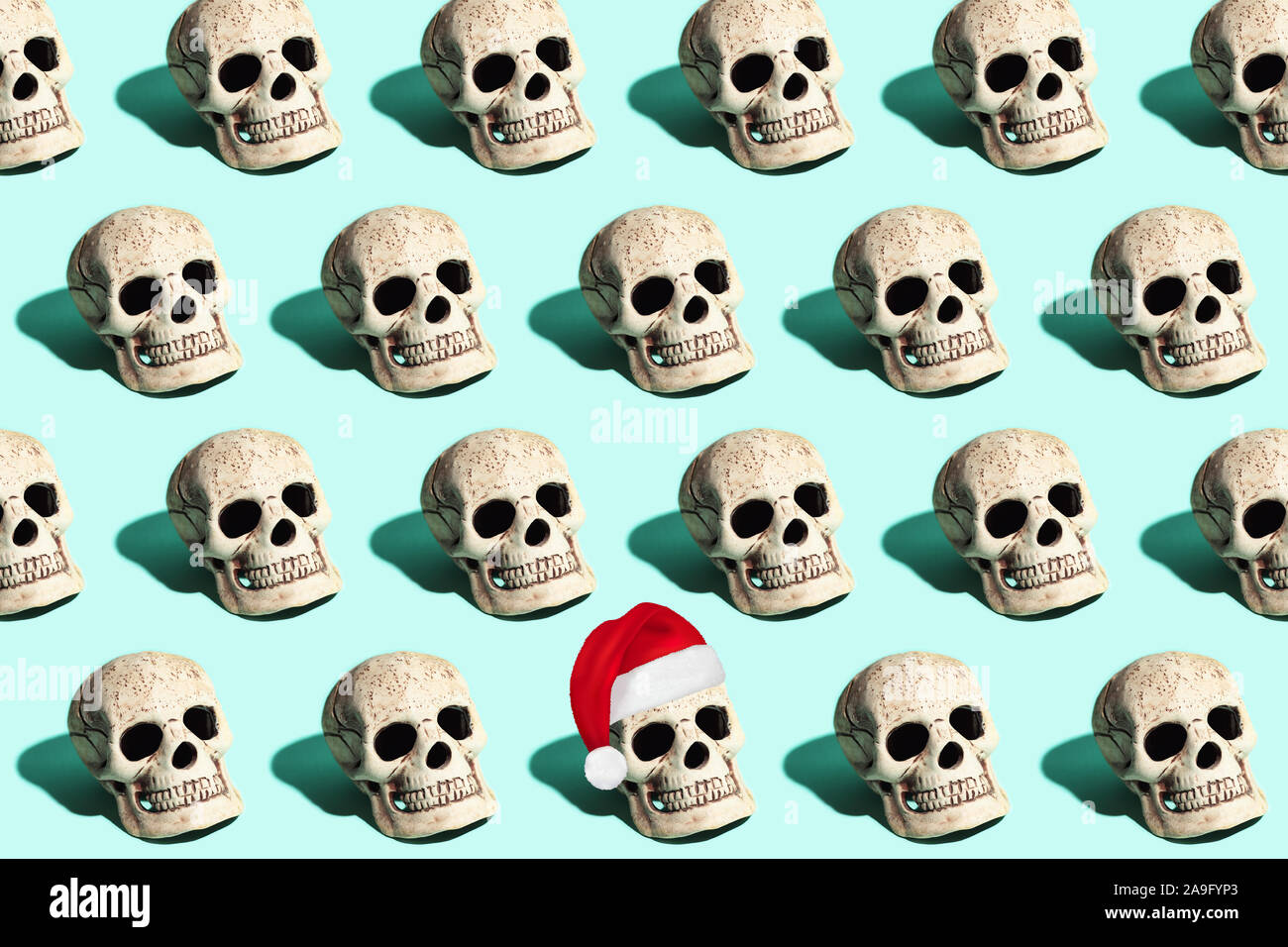 pattern skull with a hard shadow on a mint background Stock Photo - Alamy