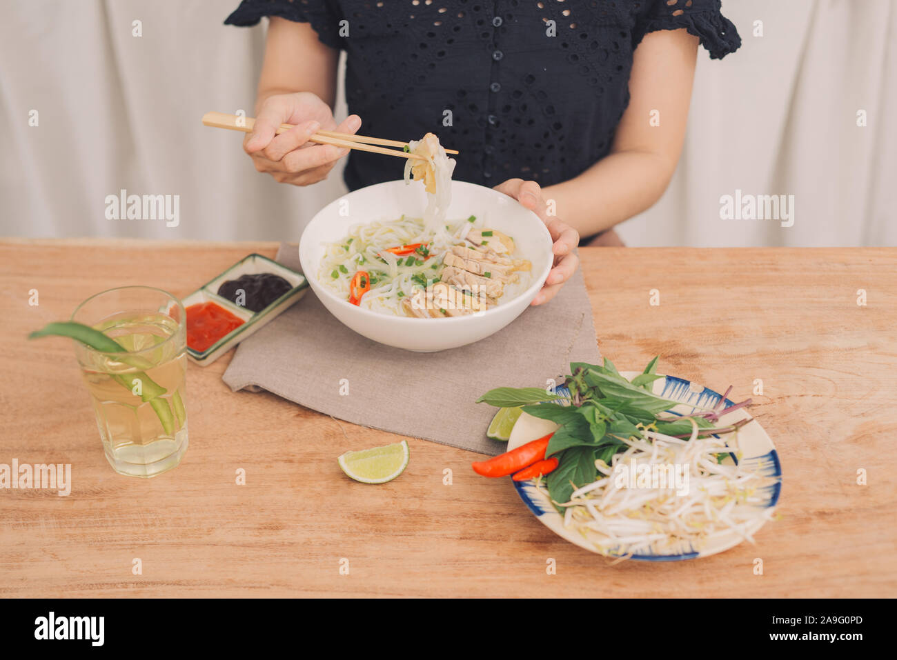 Asian dinner with vietnamese noodle soup pho bo Stock Photo - Alamy