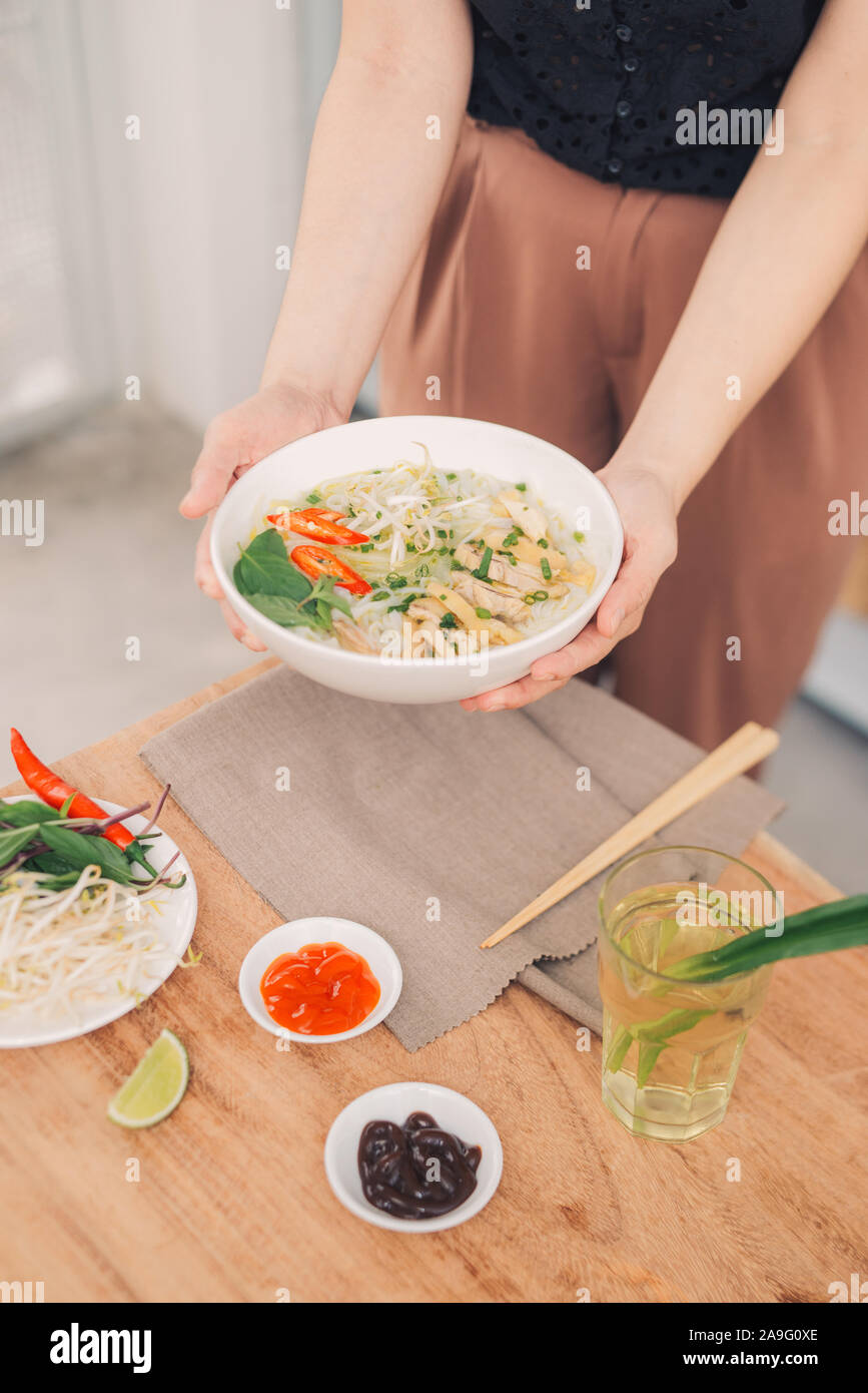 Asian dinner with vietnamese noodle soup pho bo Stock Photo - Alamy