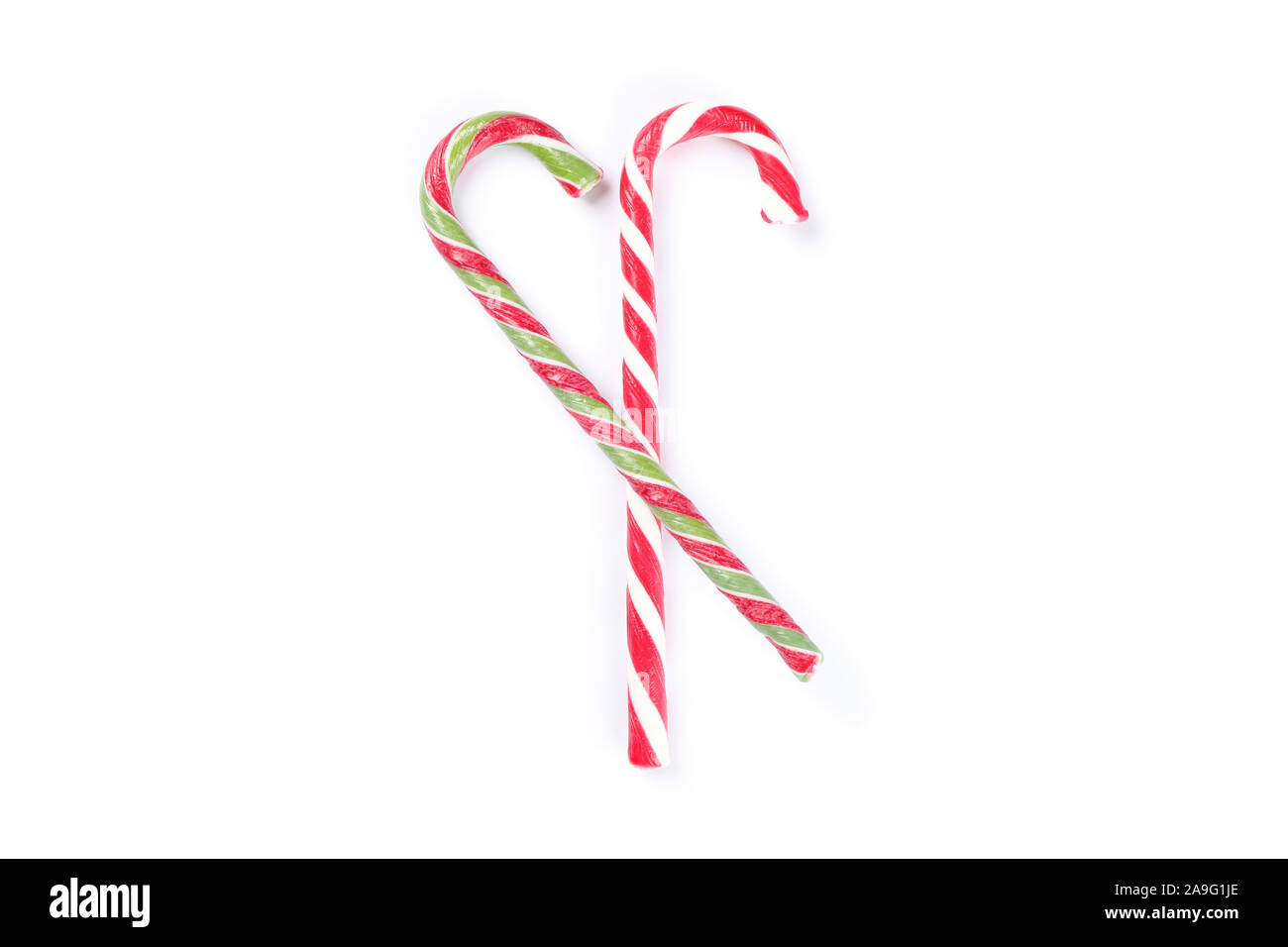 Sweet candy canes isolated on white background Stock Photo - Alamy