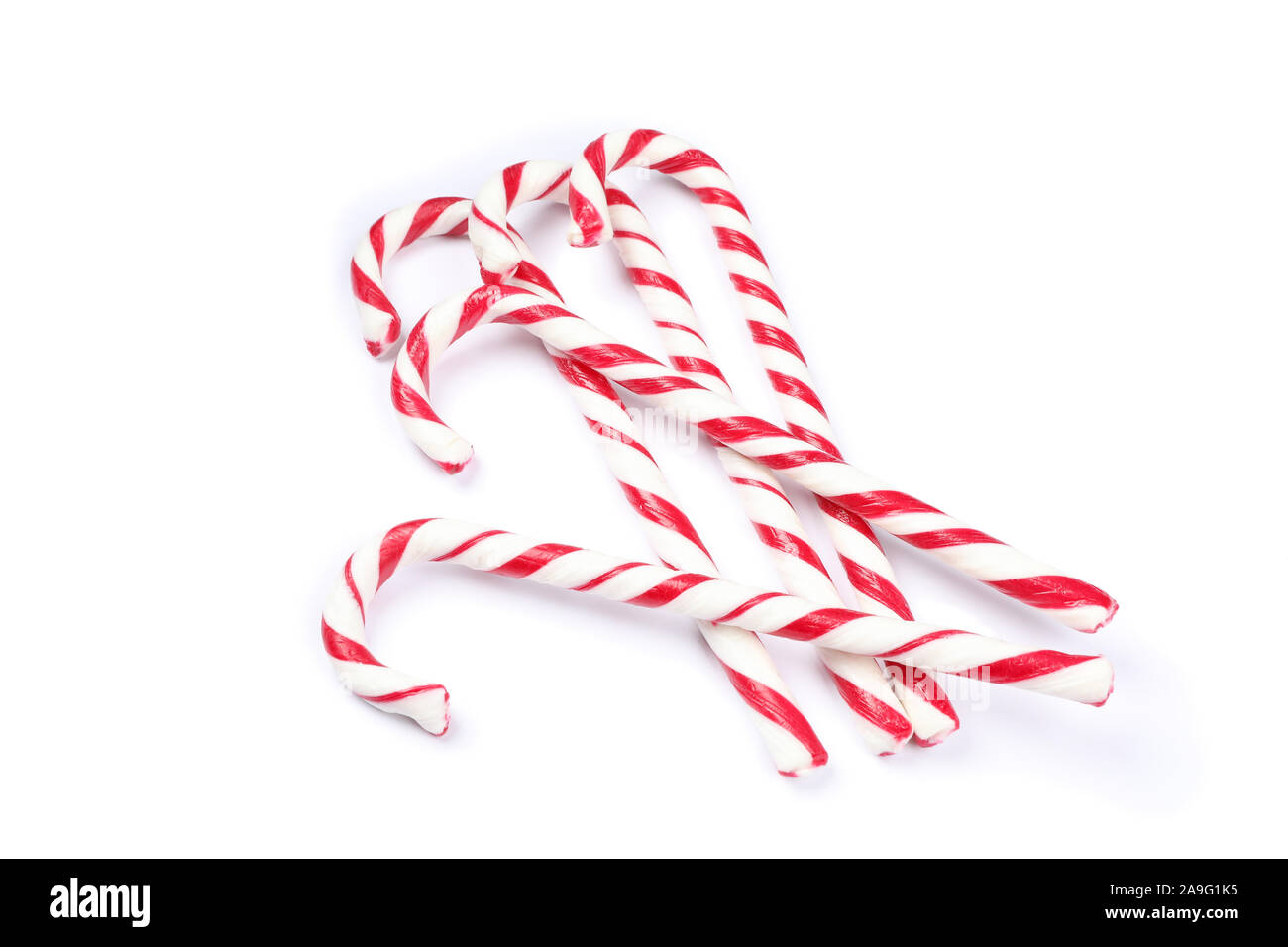 Sweet candy canes isolated on white background Stock Photo - Alamy