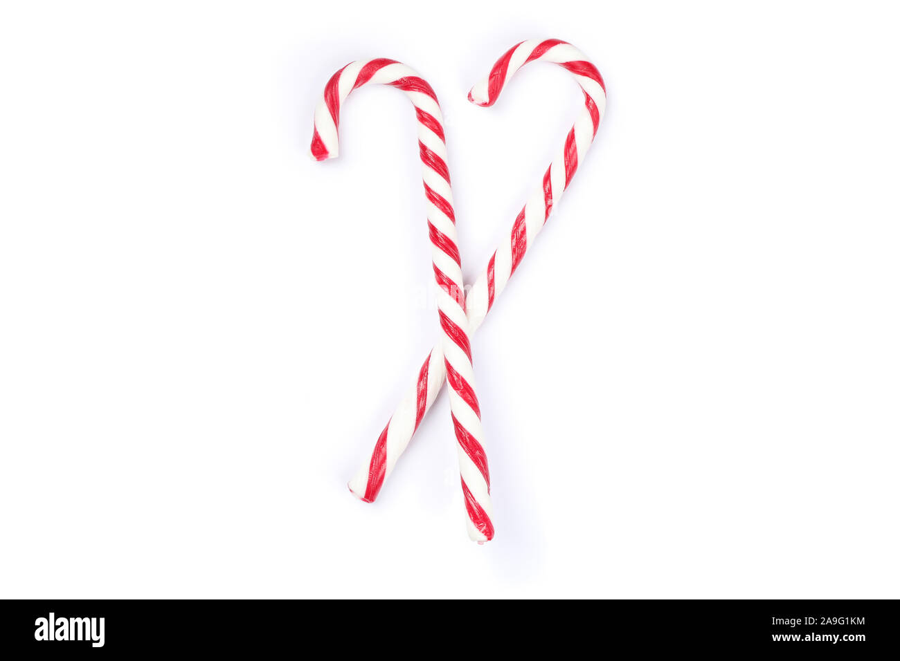 Sweet candy canes isolated on white background Stock Photo - Alamy